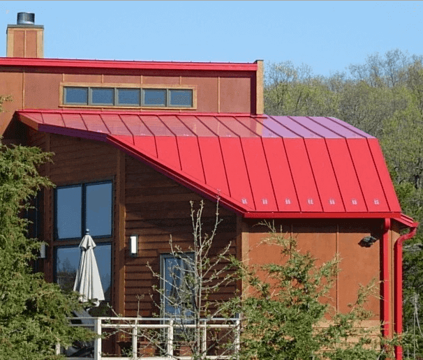Red Standing Seam Metal Roof on a Modern Home | RoofCalc.org Red Standing Seam Metal Roof on a Modern Home | RoofCalc.org